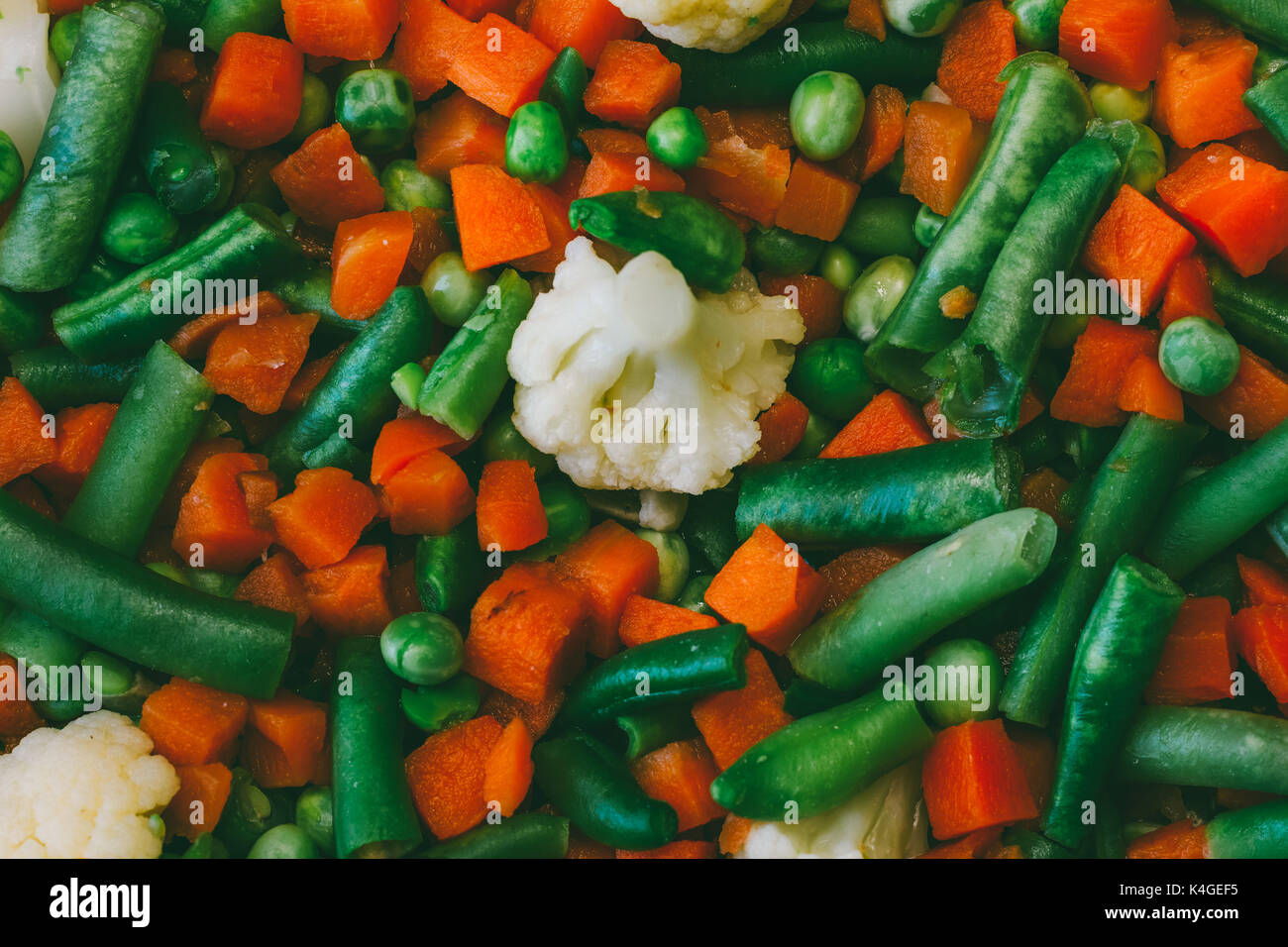 vegetable mix of carrots, peas, green beans and cauliflower close up ...