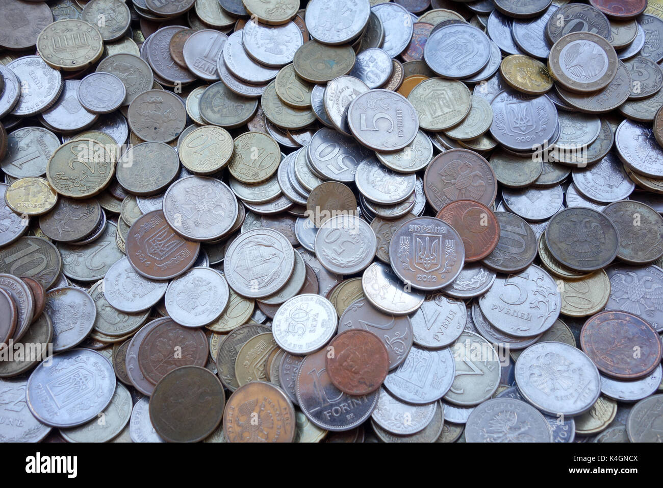 pile of world coins Stock Photo - Alamy