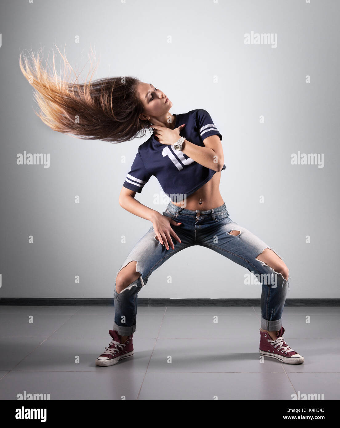 modern young beautiful dancer posing on a studio background Stock Photo ...