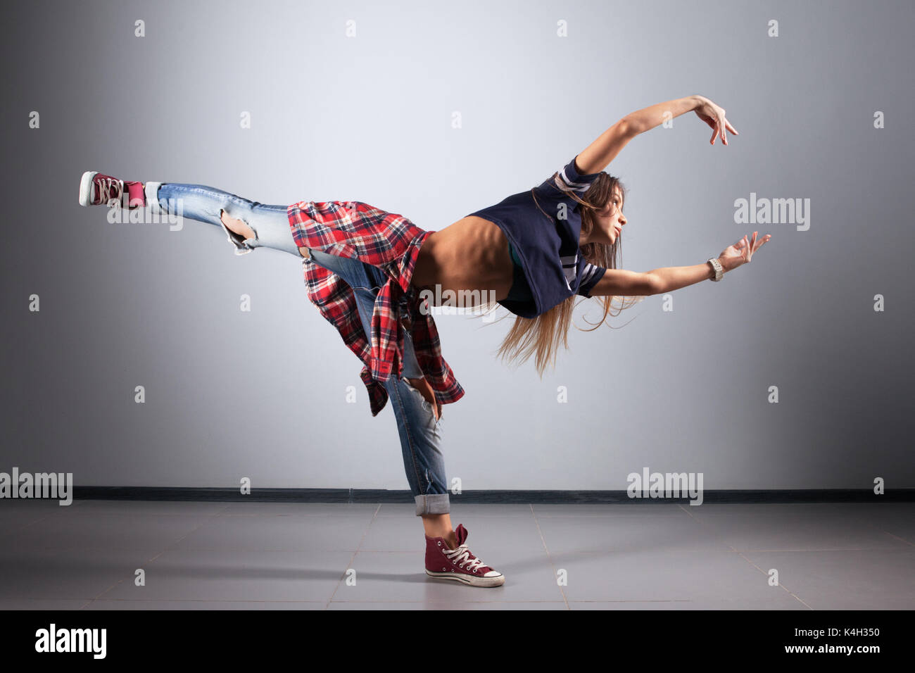 modern young beautiful dancer posing on a studio background Stock Photo ...