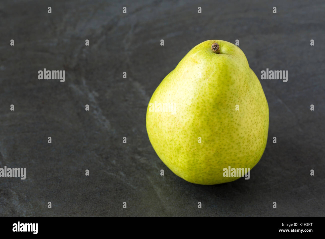 Green Anjou Pear on the slate background Stock Photo - Alamy