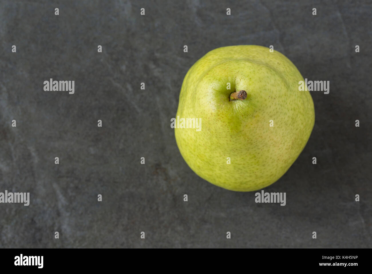 Green Anjou Pear on the slate background Stock Photo - Alamy
