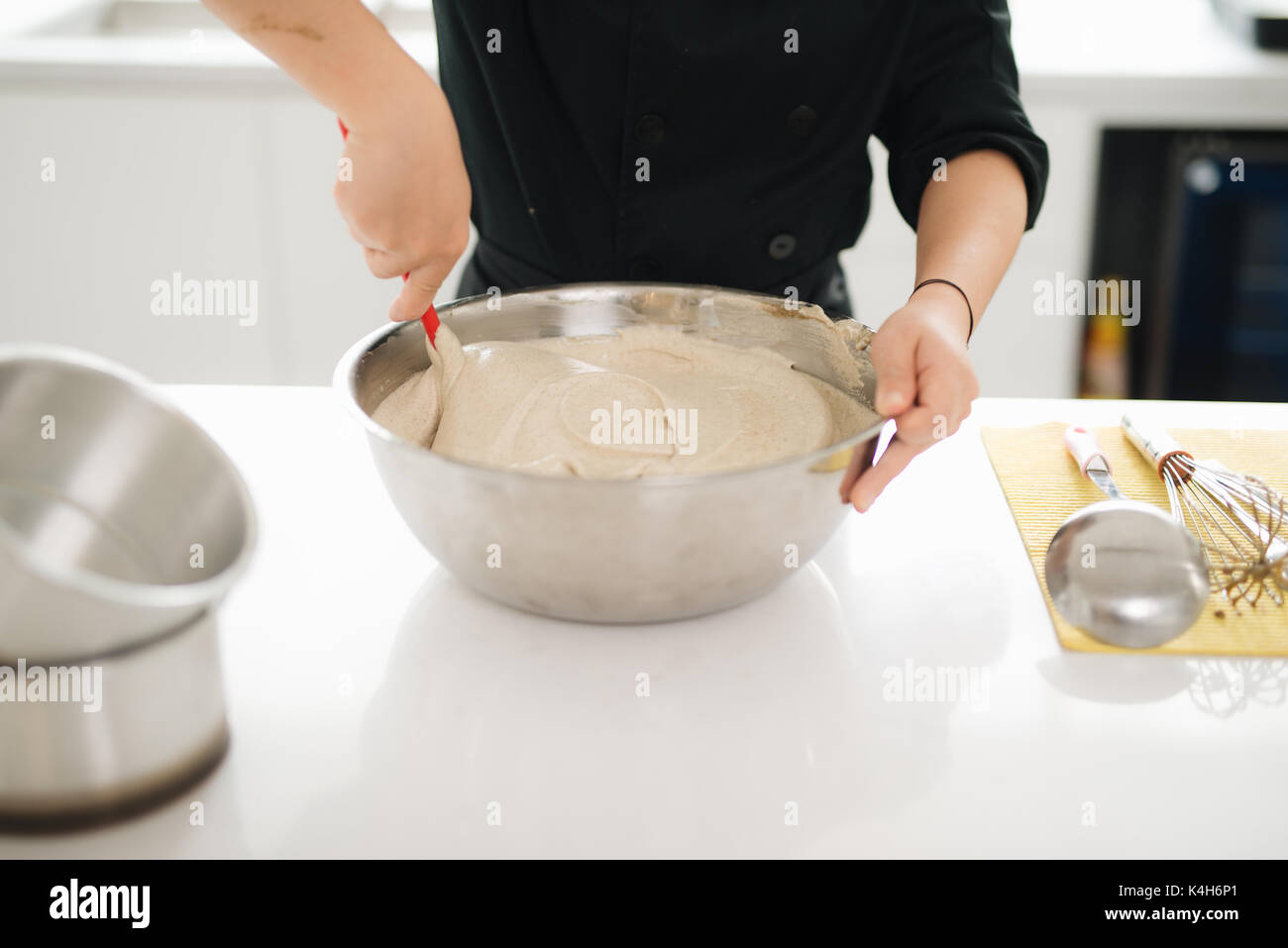 Bakery chef cooking bake in the kitchen professional Stock Photo - Alamy