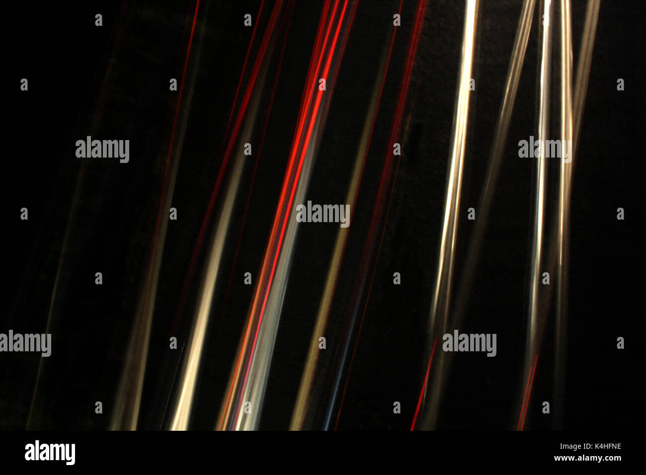 Moving vehicle light trails, shot on a slow shutter speed from above ...