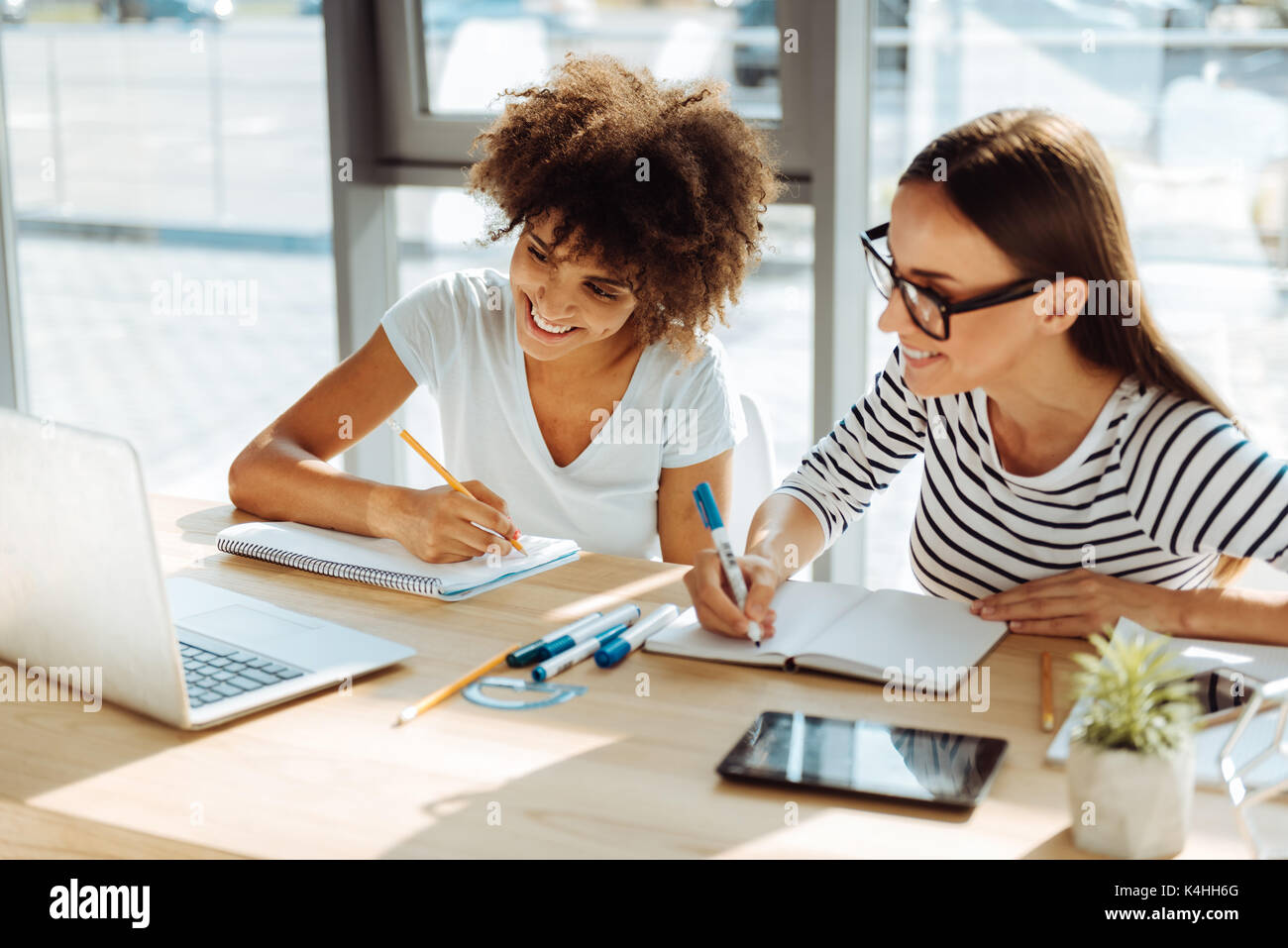 Girls friends studying together concept hi-res stock photography and ...