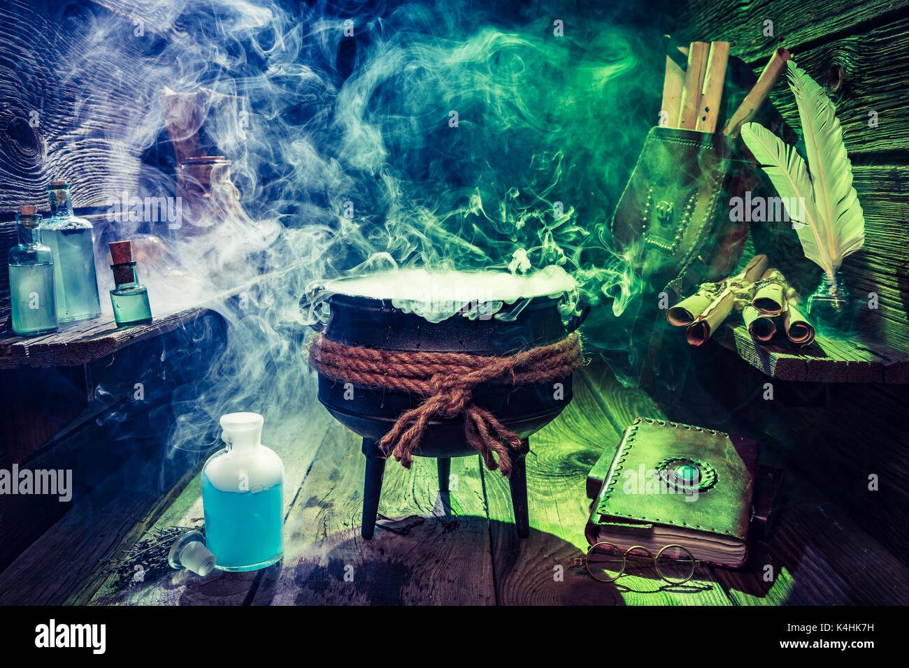 Vintage witch pot with book, potions and scrolls for Halloween Stock ...