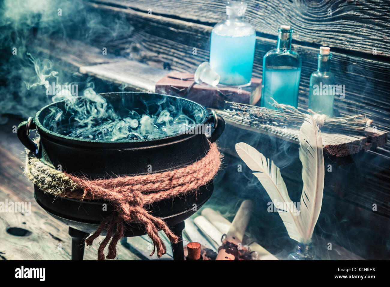 Witch pot with potions and scrolls for Halloween Stock Photo - Alamy