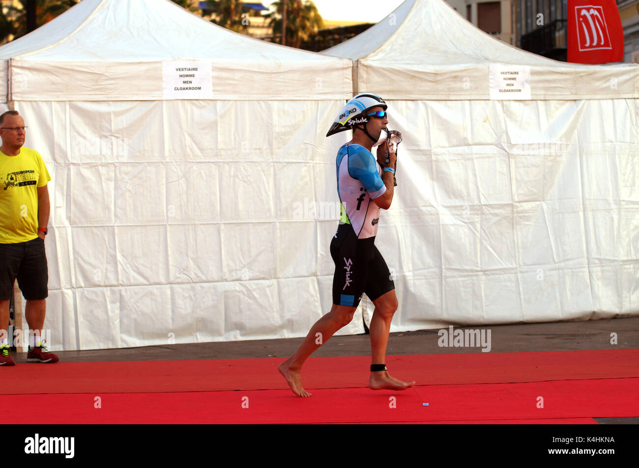 A competitor finishing swimming and preparing for the 180 km bike tour ...