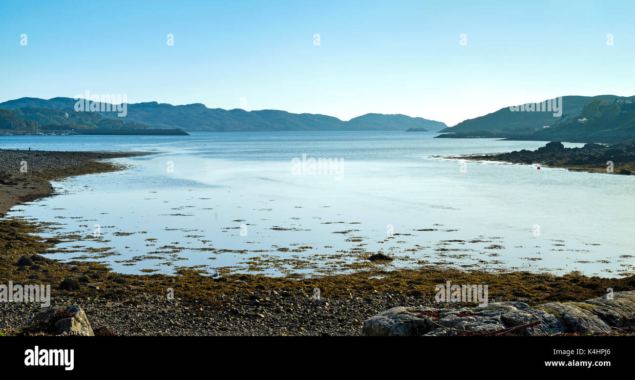 The mouth of the River Inver as it joins Loch Inver at low tide, on a ...