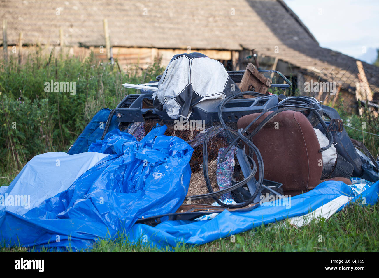 heap of old trash on the back yard Stock Photo - Alamy
