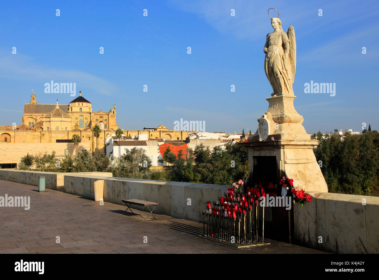 Angel San Rafael statue on Roman bridge with views cathedral, Cordoba ...