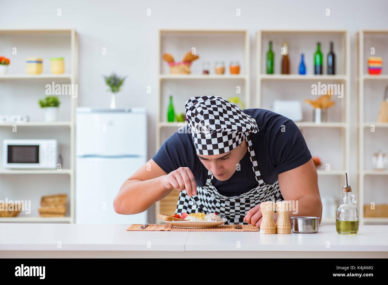 Chef cook cooking a meal breakfast dinner in the kitchen Stock Photo ...