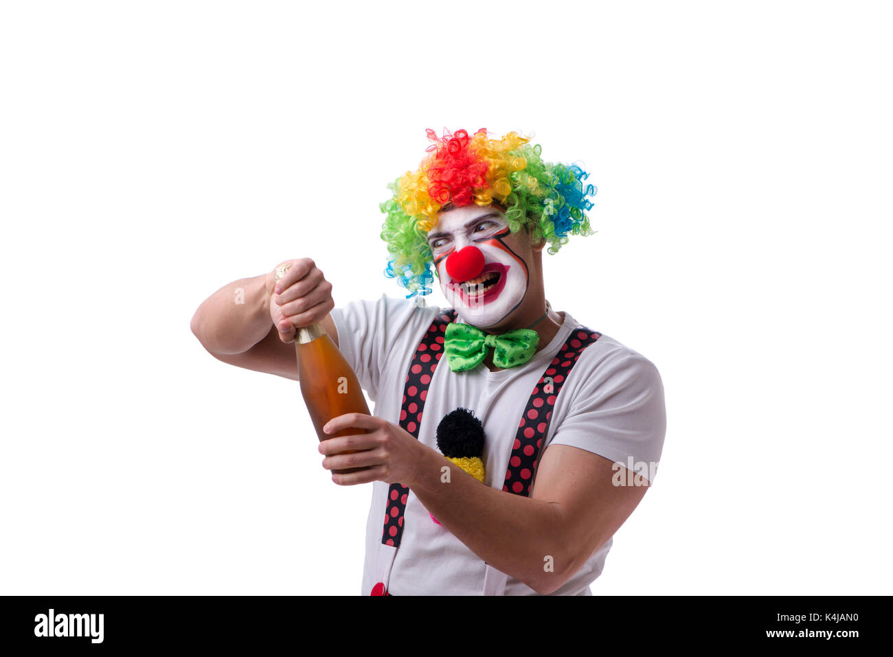 Funny clown with a bottle isolated on white background Stock Photo - Alamy