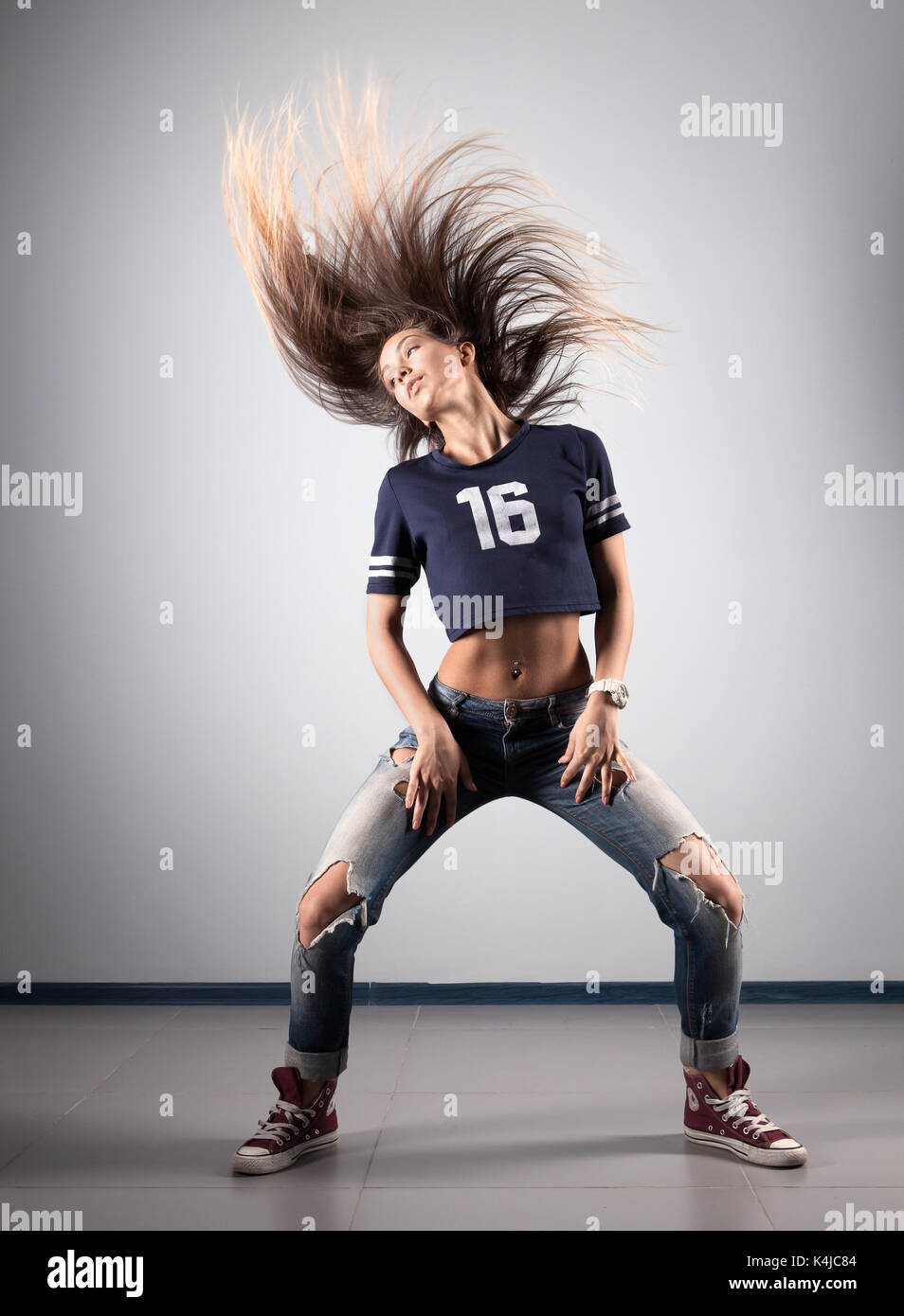 modern young beautiful dancer posing on a studio background Stock Photo ...