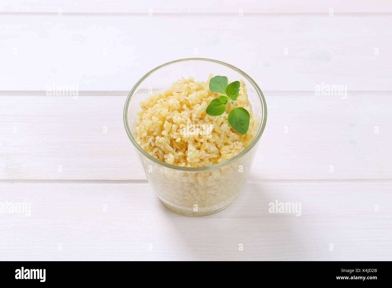Cooked whole groats in glass Stock Photo - Alamy