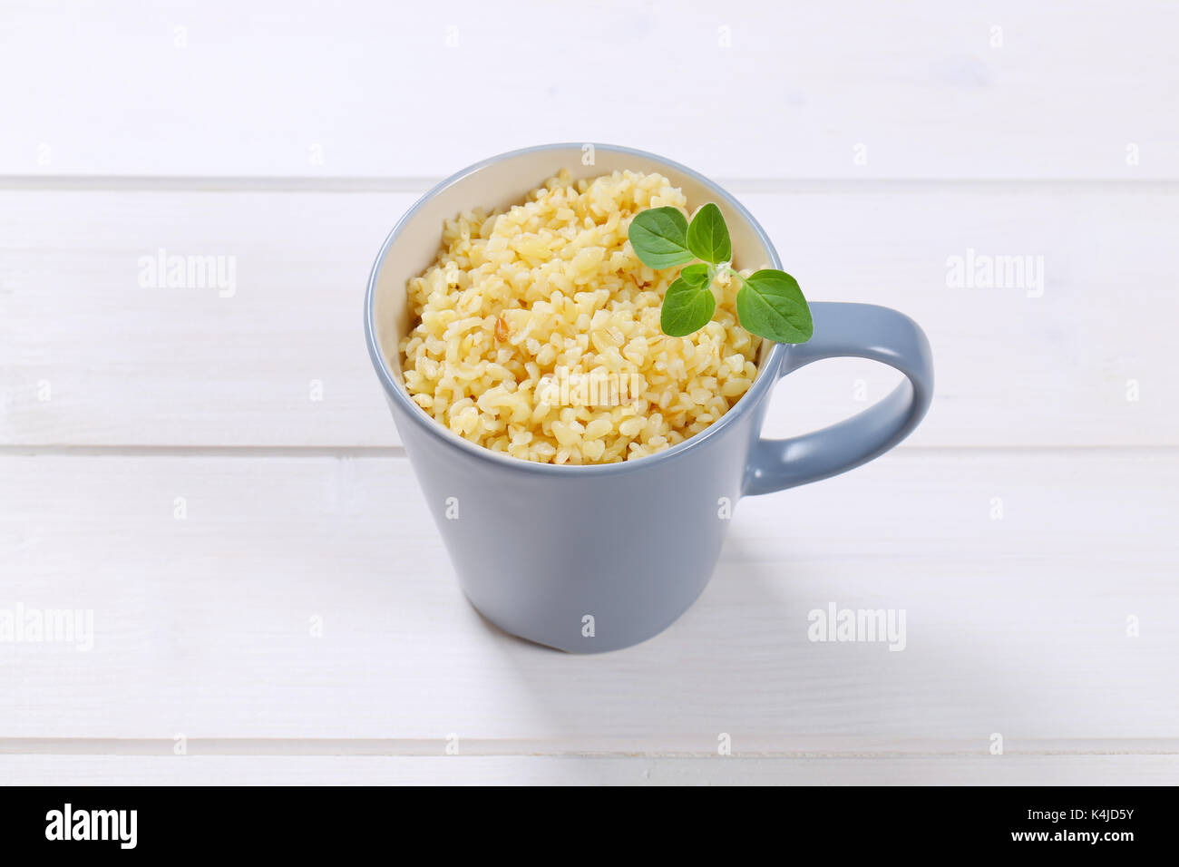 Cooked whole groats in a cup Stock Photo - Alamy