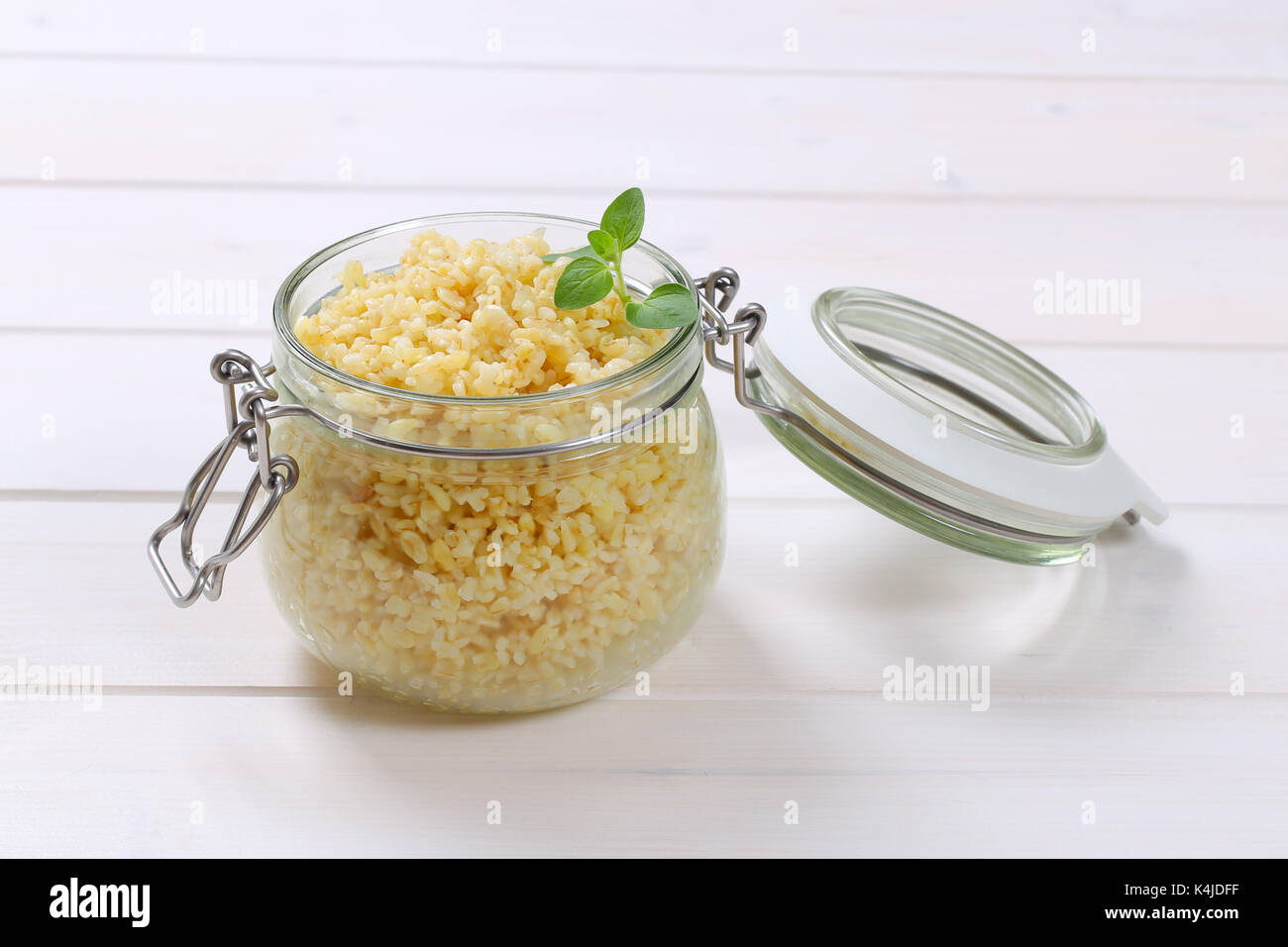 Cooked whole groats in a jar Stock Photo - Alamy