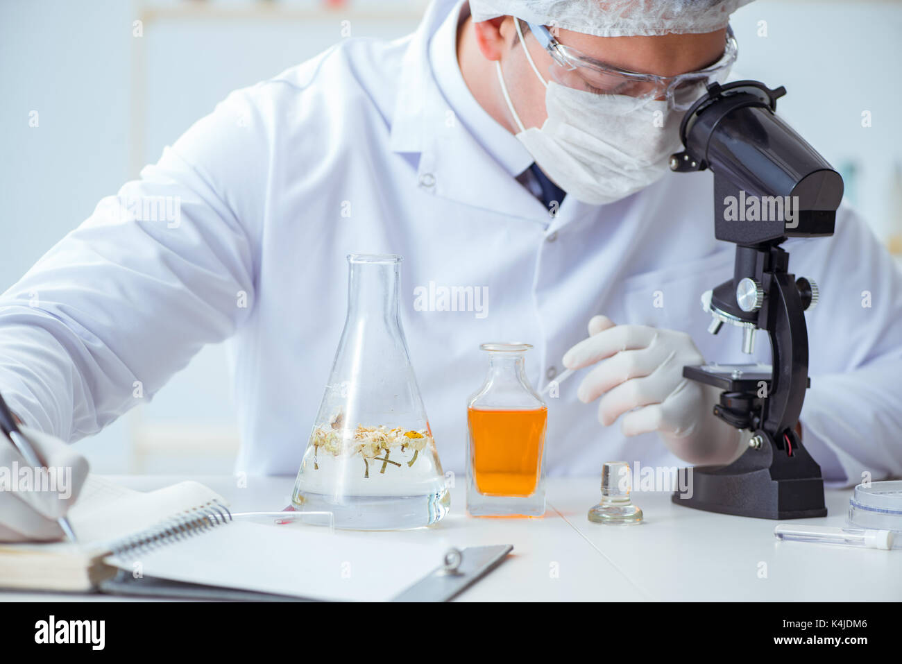Chemist mixing perfumes in the lab Stock Photo - Alamy