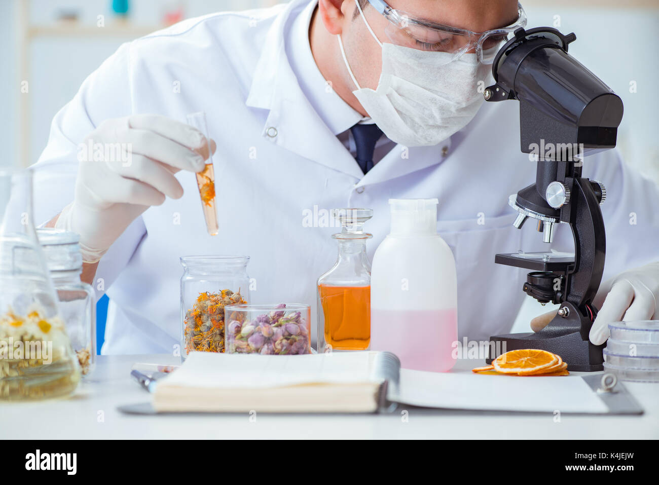 Chemist mixing perfumes in the lab Stock Photo - Alamy