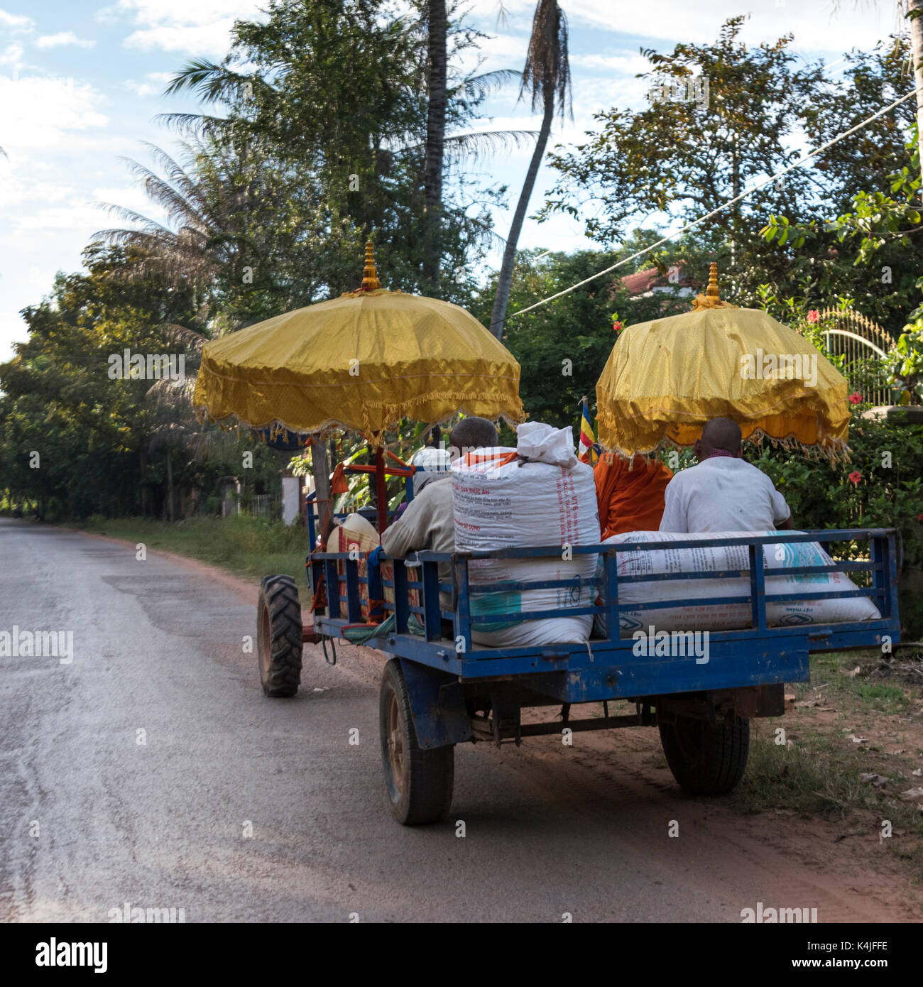 People sitting in trailer on road, Preah Dak, Siem Reap, Cambodia Stock ...