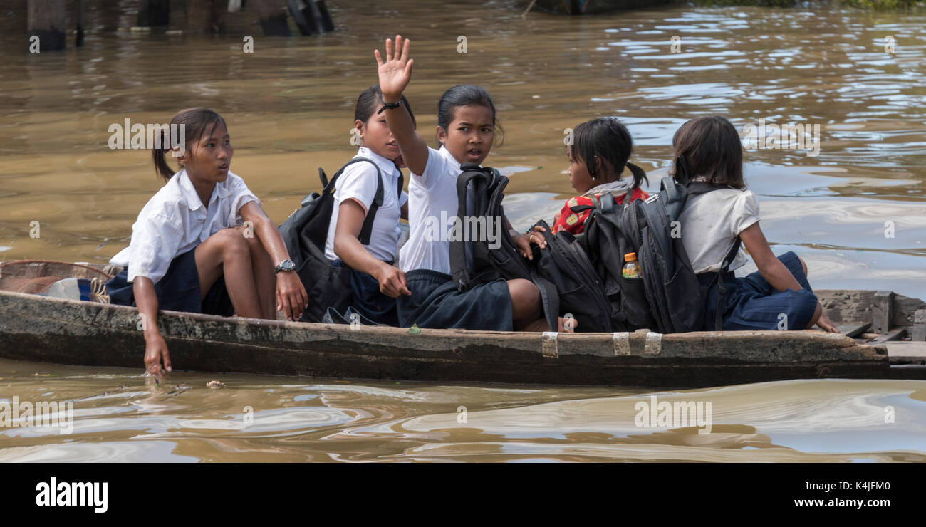 Students on their way to school by boat in Tonle Sap lake, Kampong ...