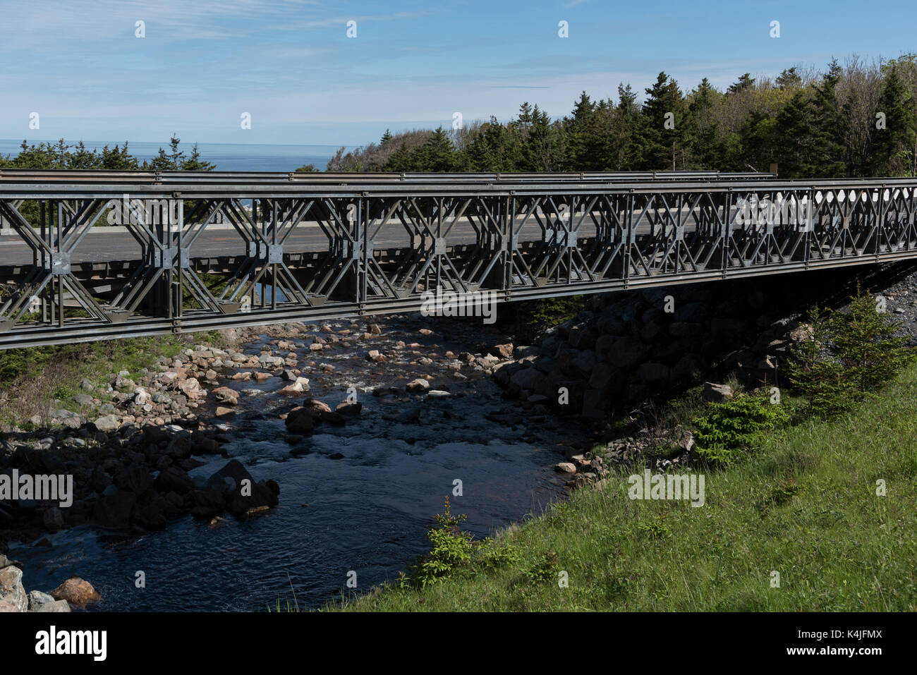 Bridge across river in forest, Pleasant Bay, Cape Breton Highlands ...