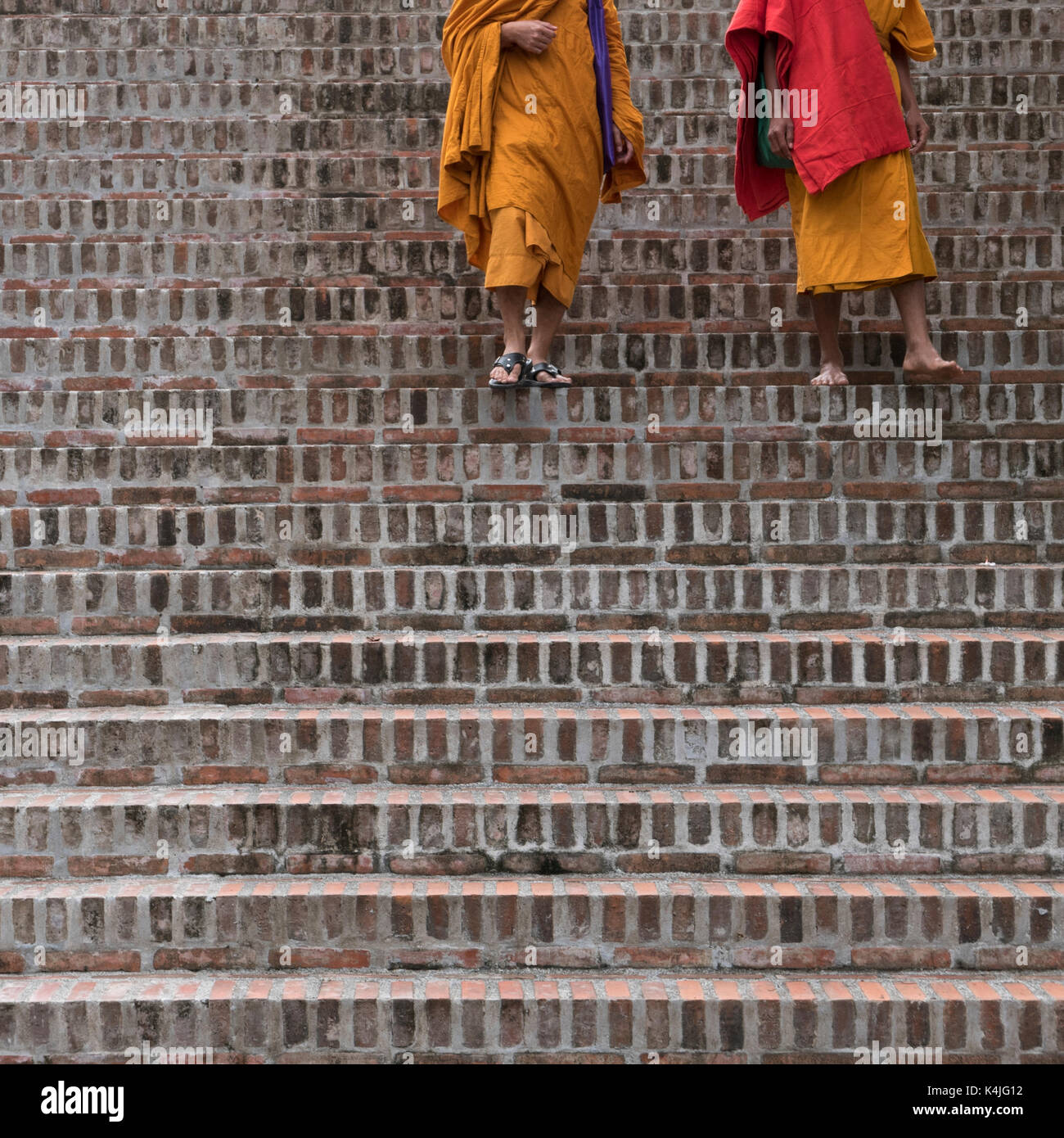 Monks walking down staircase, Luang Prabang, Laos Stock Photo - Alamy