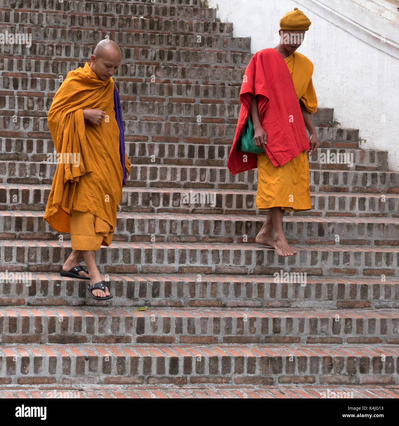Monk walking down stairs hi-res stock photography and images - Alamy