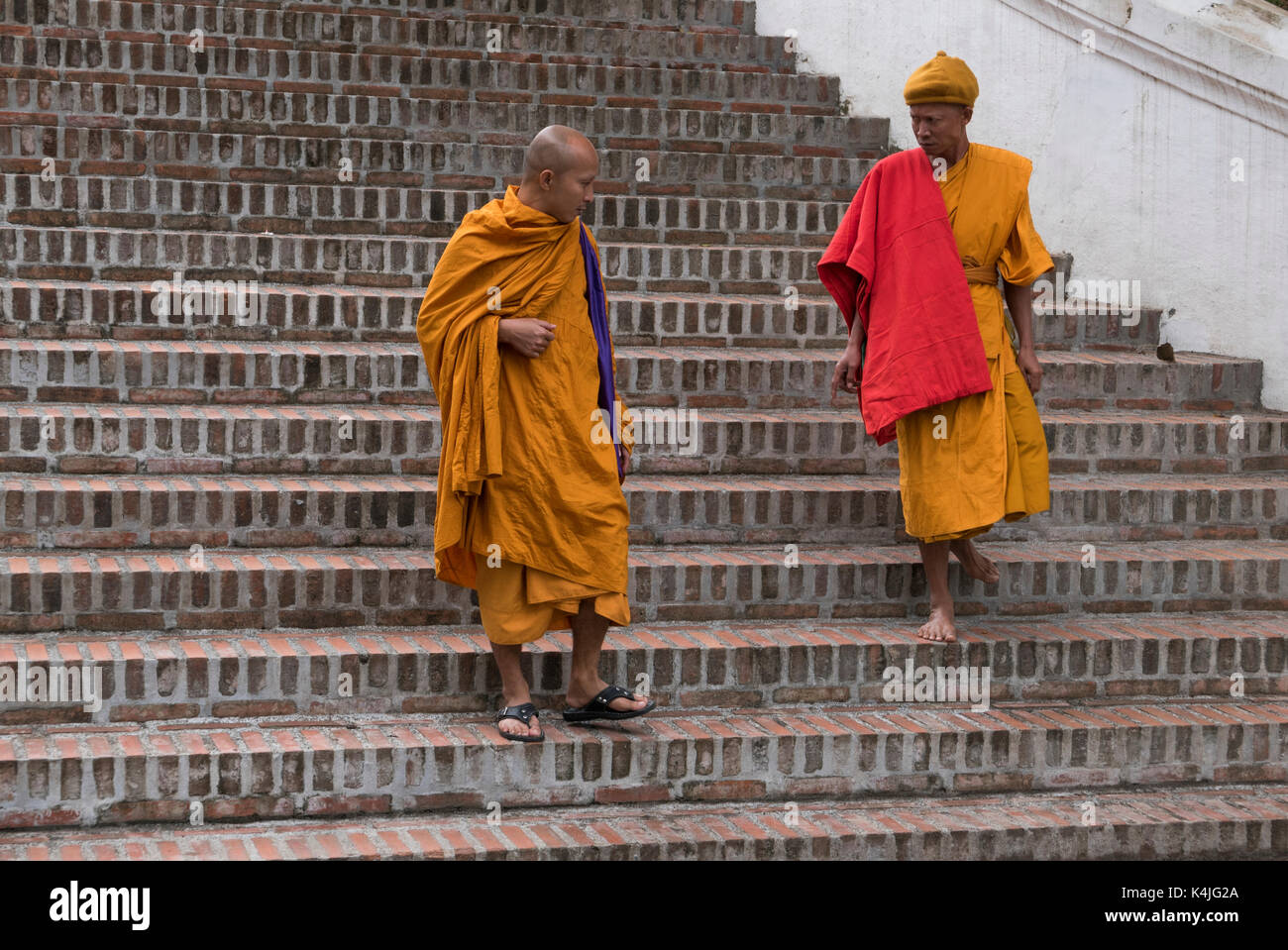 Monk walking down stairs hi-res stock photography and images - Alamy