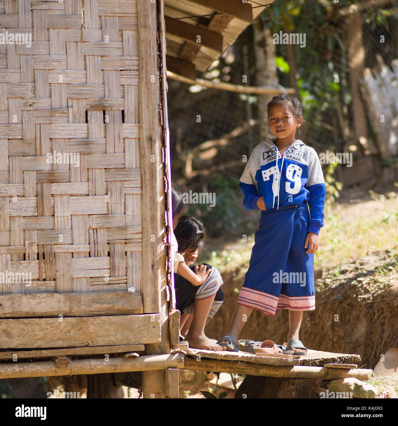 Portrait of local adolescent girl standing outside a hut, Ban Houy Phalam, Laos Stock Photo - Alamy