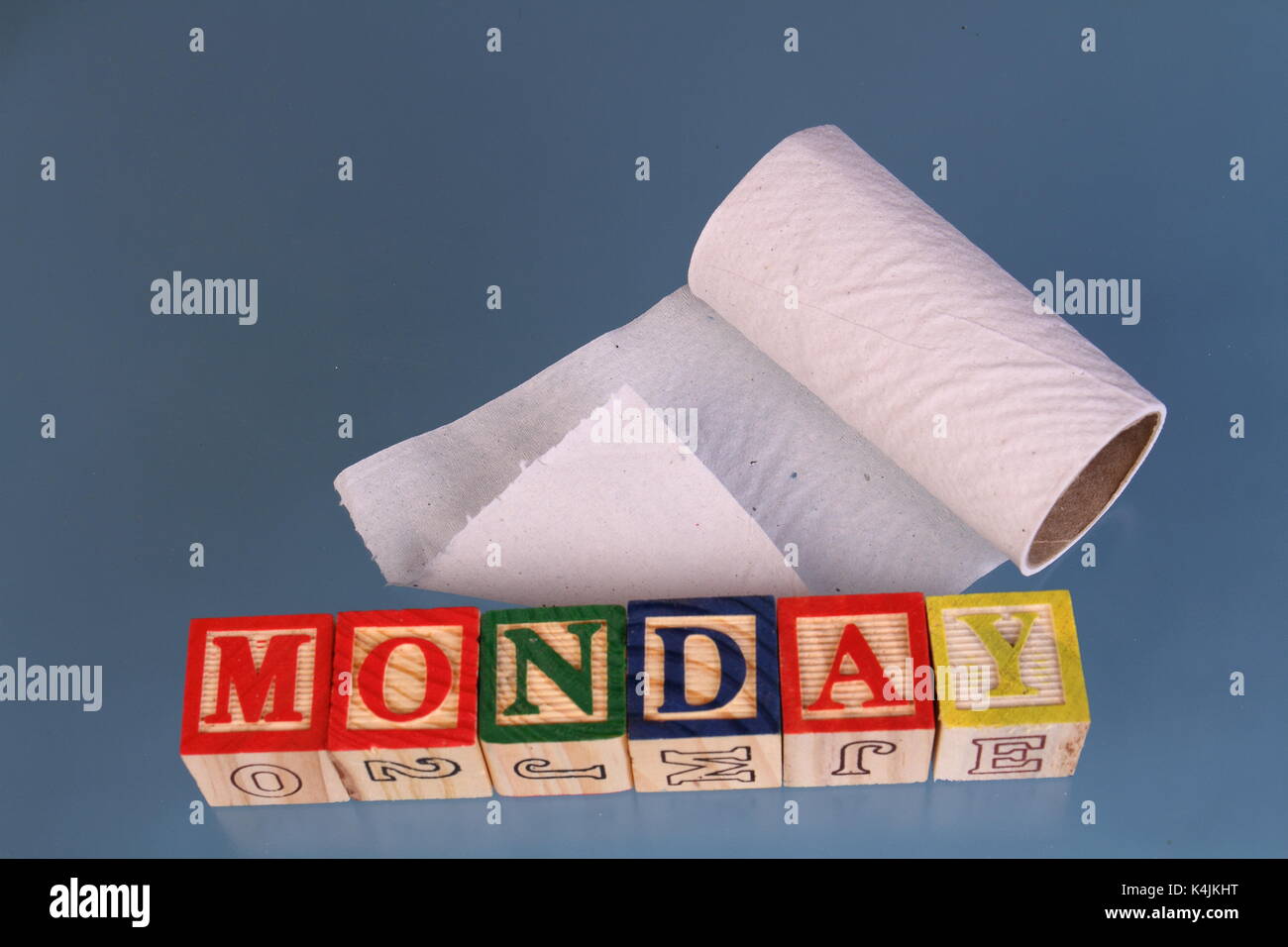 The term Monday displayed visually next to a toilet roll on a clear ...
