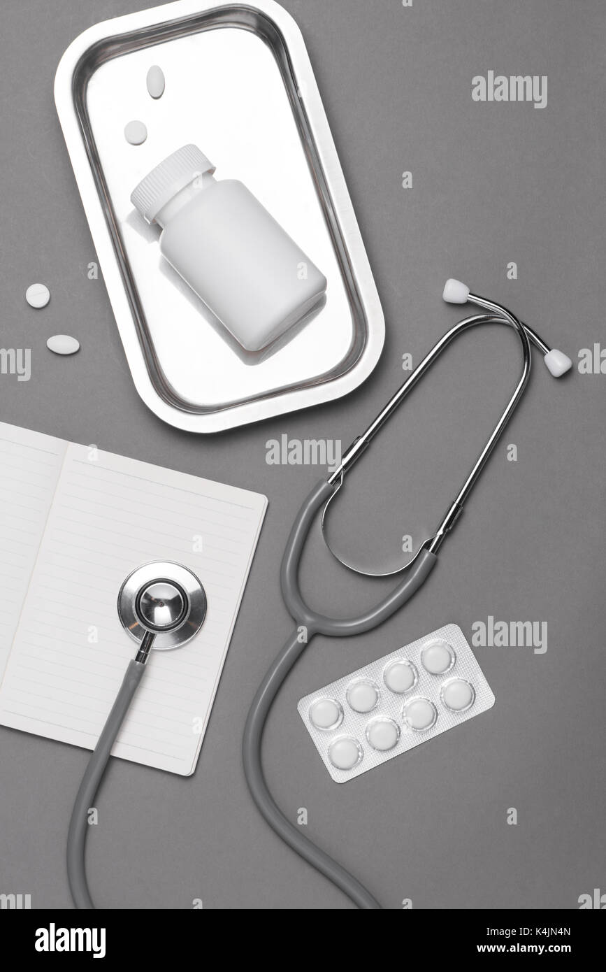 Top view of doctor desk table with stethoscope and medical items. Flat ...