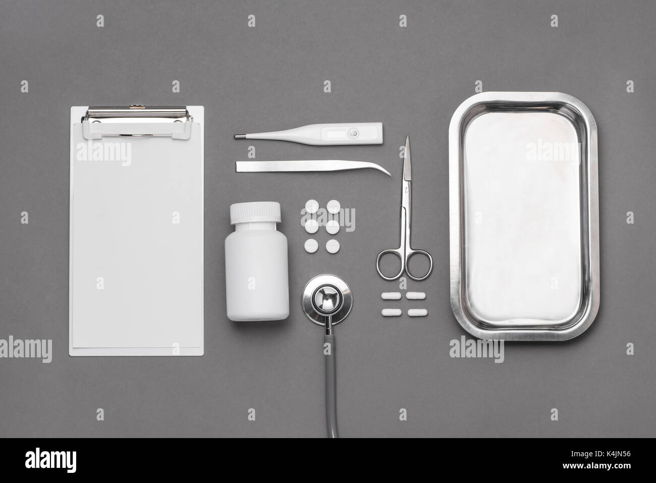 Top view of doctor desk table with stethoscope and medical items. Flat ...