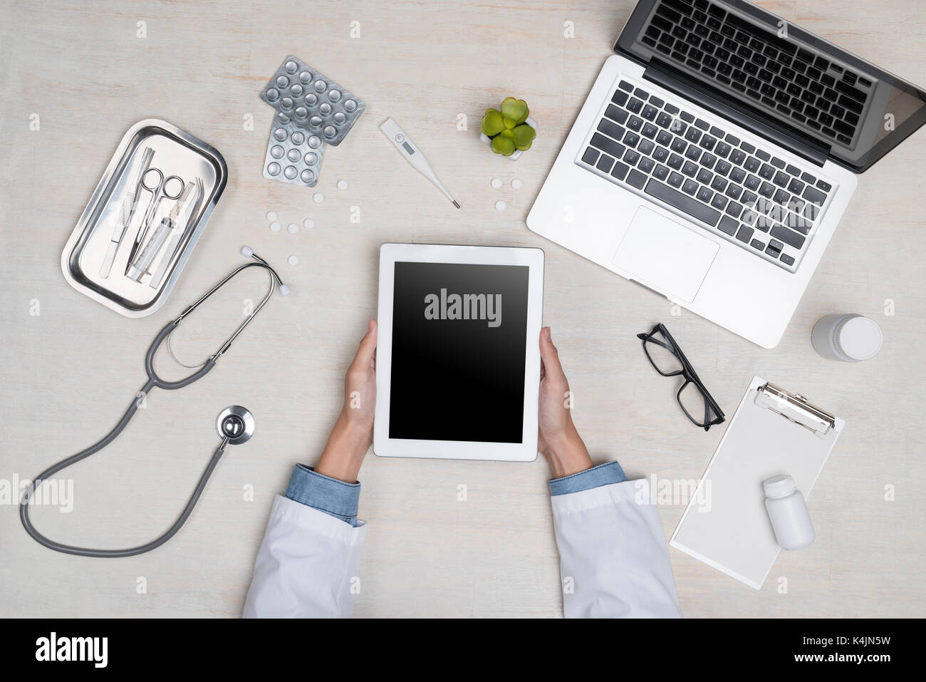 Top view of Medicine doctor hand working on the desk Stock Photo - Alamy