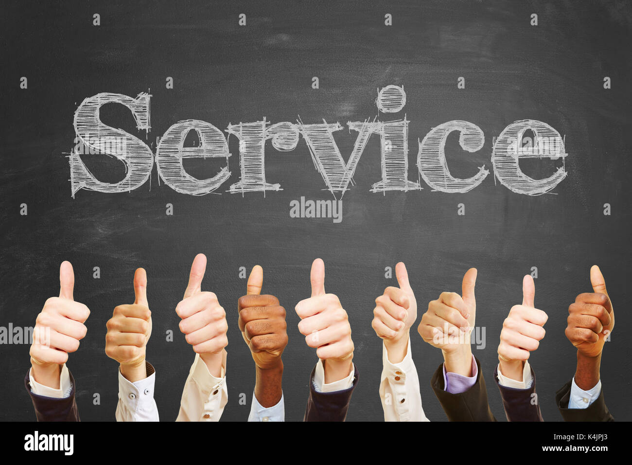 Service writen on blackboard with many business hands holding thumbs up ...