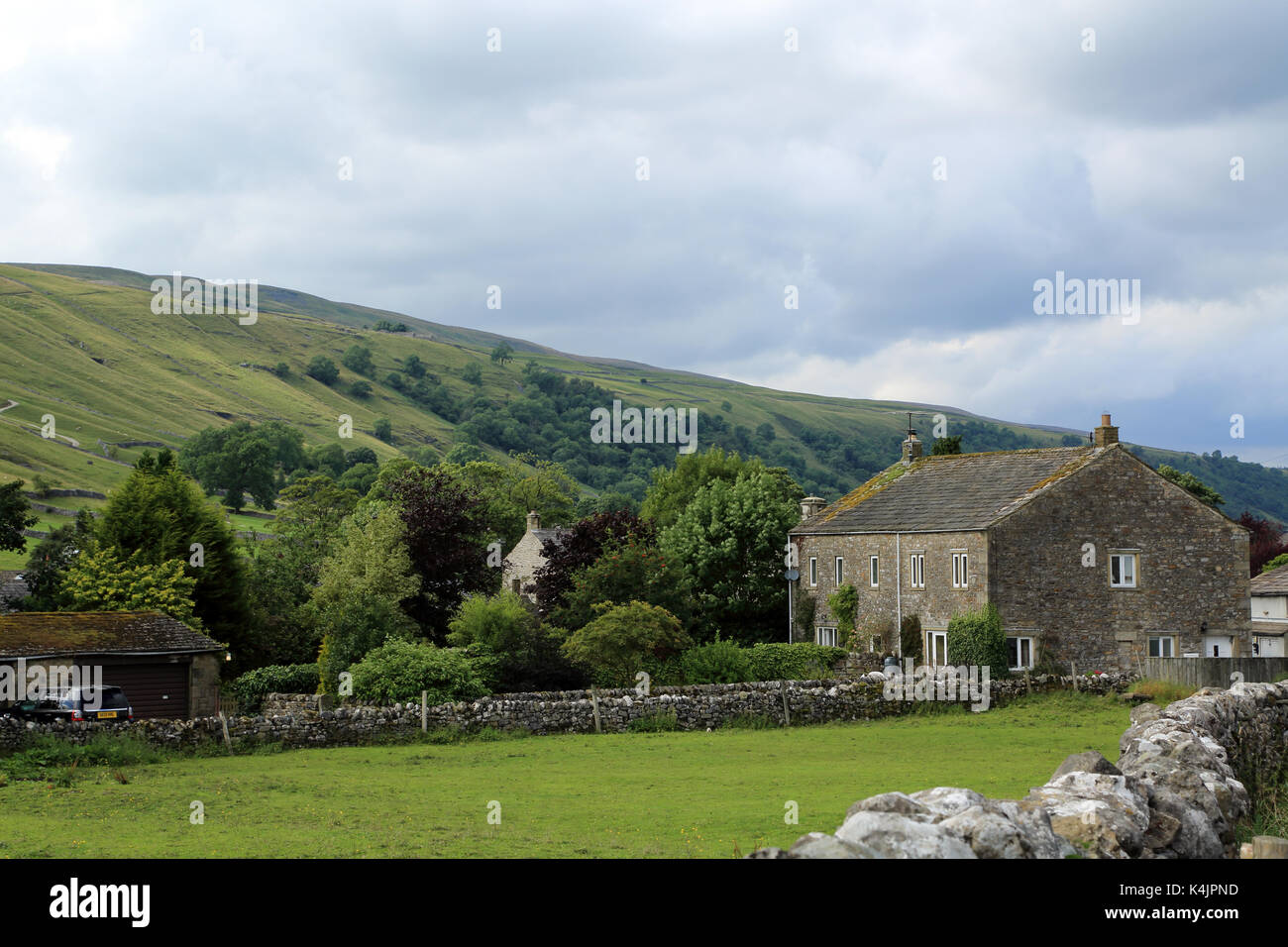 Traditional stone farmhouse with field and Hawkswick Moor in the ...