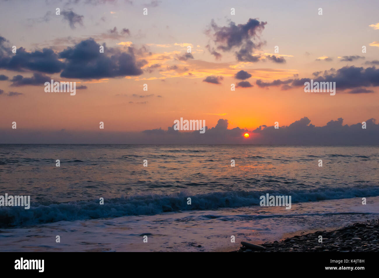 Summer sea sunset, the sun, waves and clouds, beautiful dramatic ...