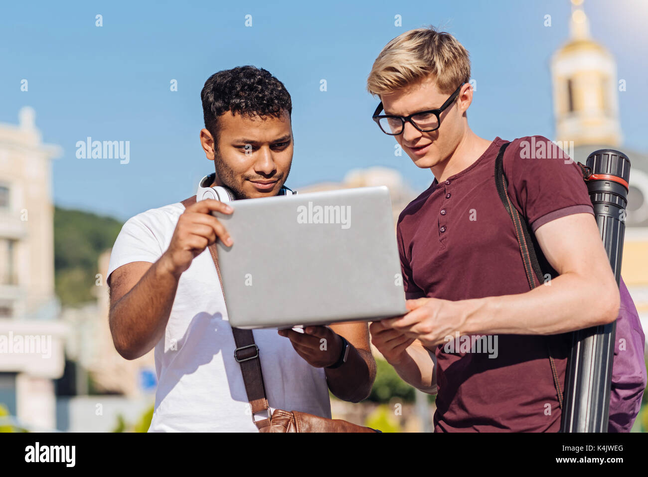 Serious brunette reading information before lecture Stock Photo - Alamy