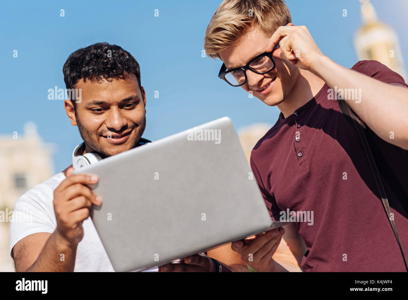 Attentive students checking email from tutor Stock Photo - Alamy