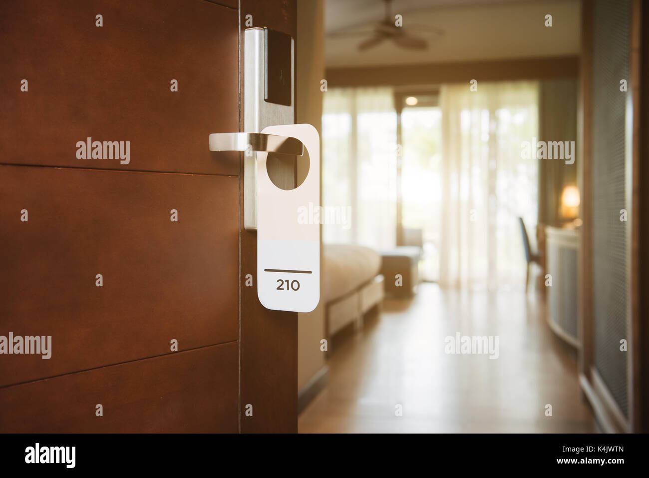 The hotel room with Room Number sign on the door Stock Photo - Alamy
