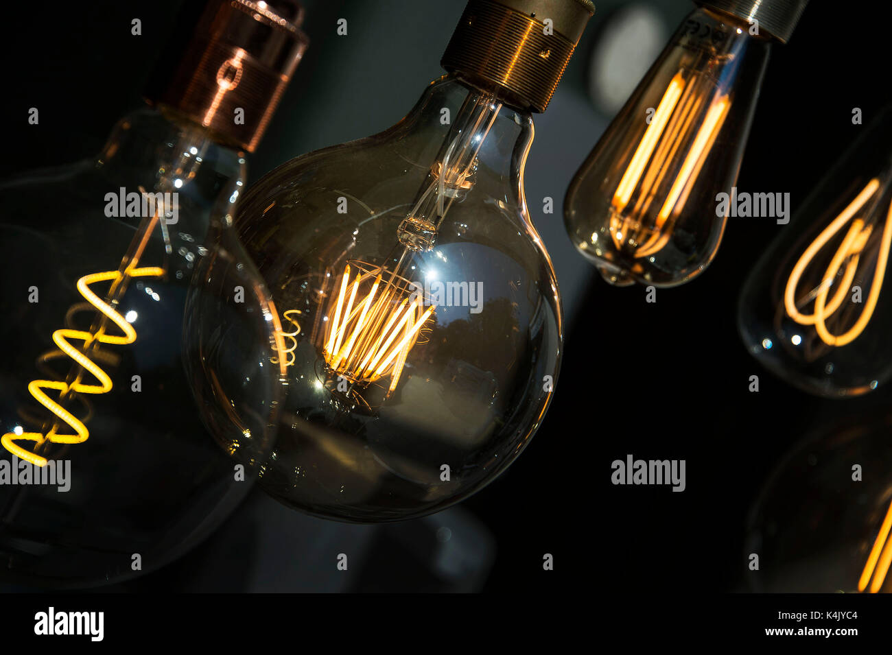 A selection of filament lightbulbs glowing in a shop window. Credit ...