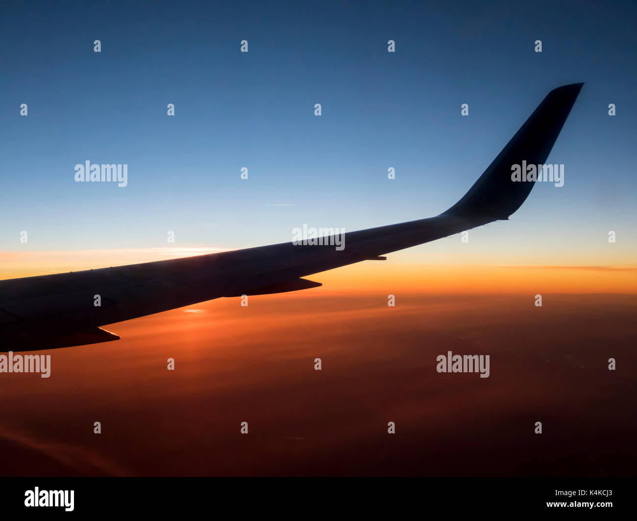 Airplane wing in sunrise, Germany Stock Photo - Alamy