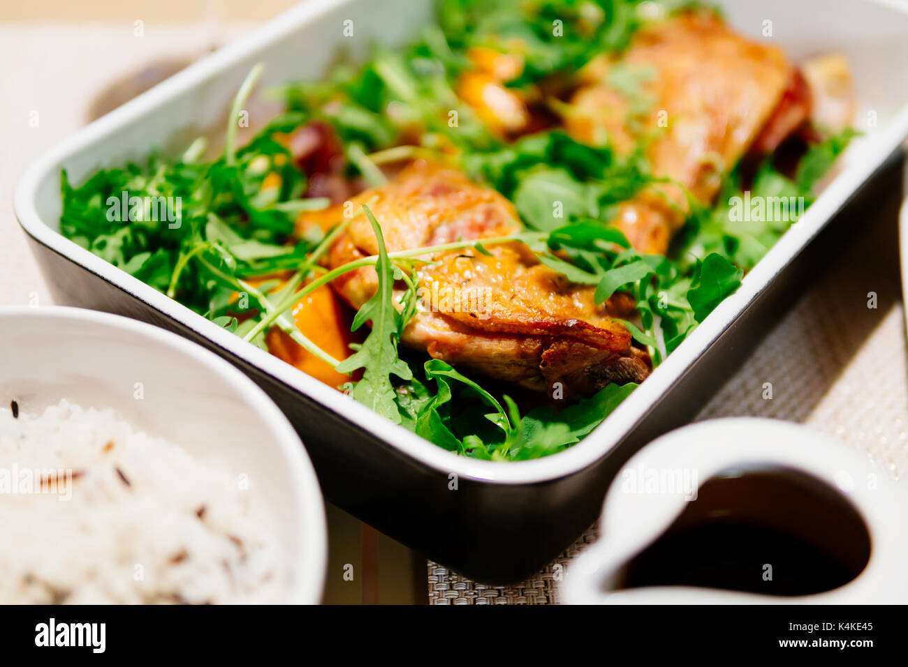 Cooked Duck Legs In Oven With Rocket Salad And Citrus Sauce Stock Photo ...