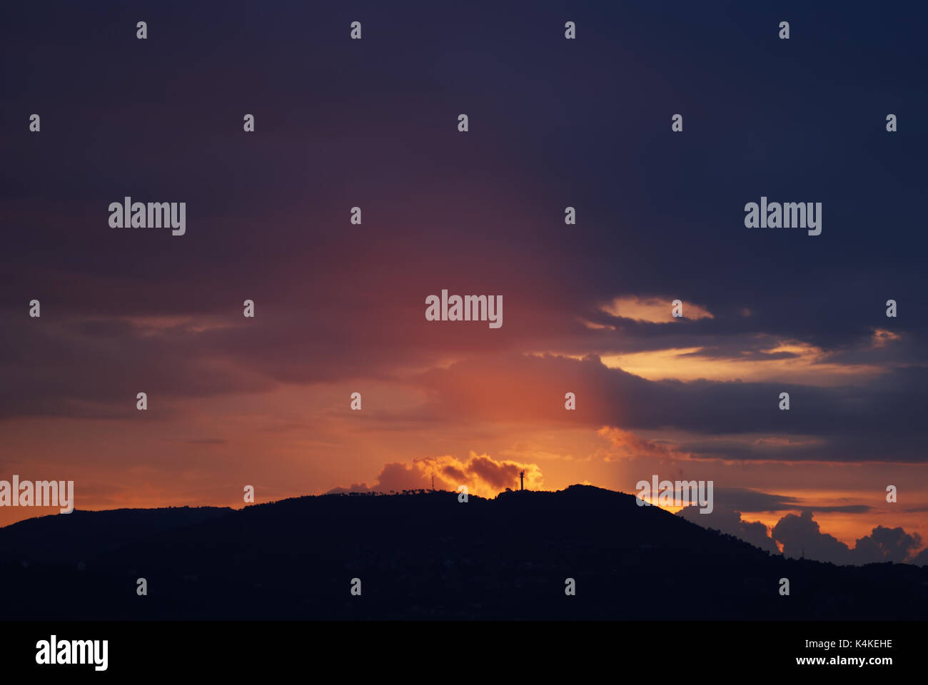 Photo of sun shine through rain cloud Stock Photo - Alamy