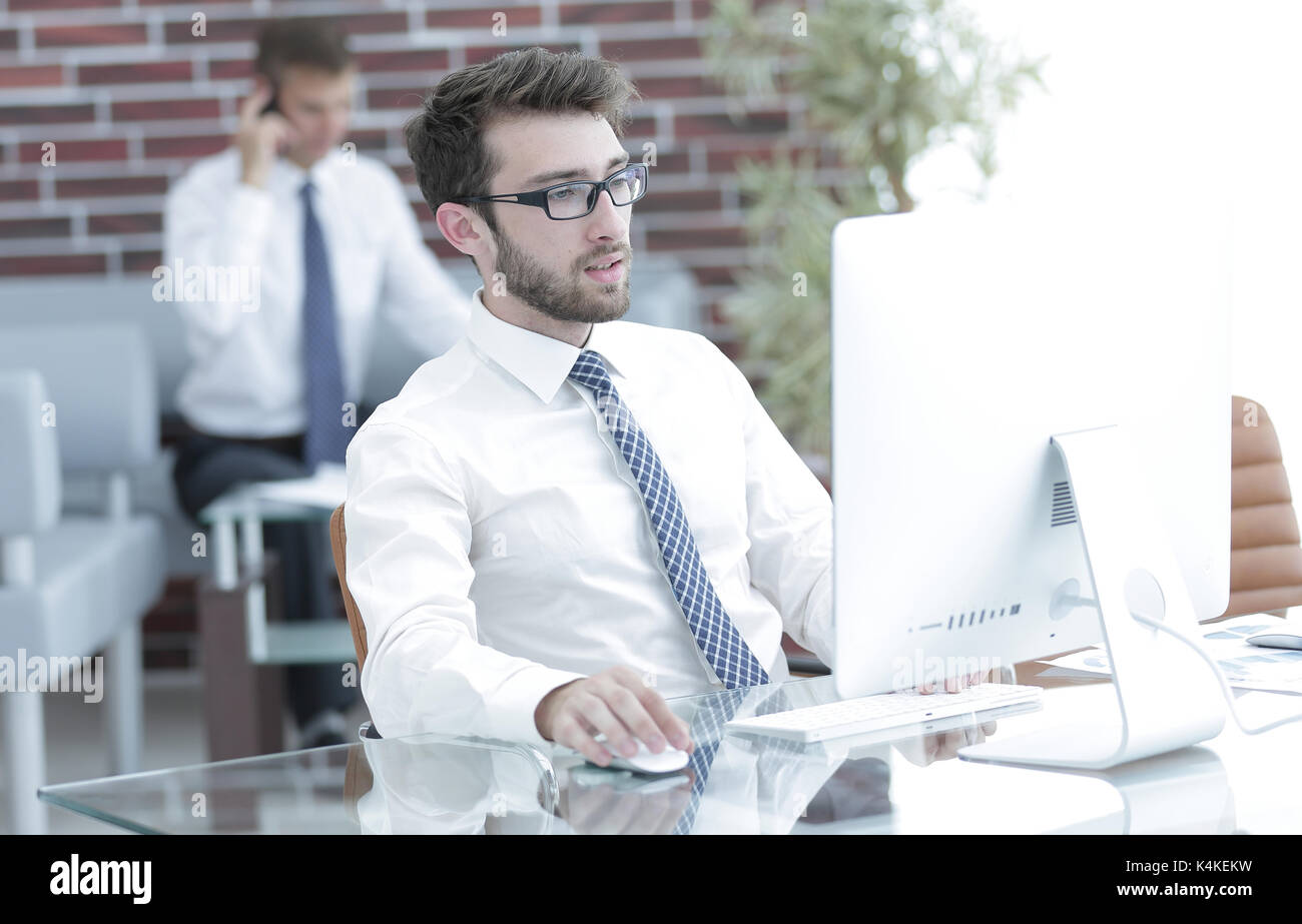 Manager works on a computer Stock Photo - Alamy