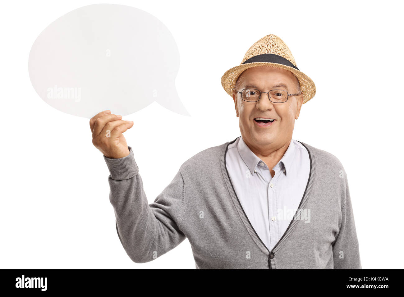 Mature man holding a chat bubble and smiling isolated on white ...