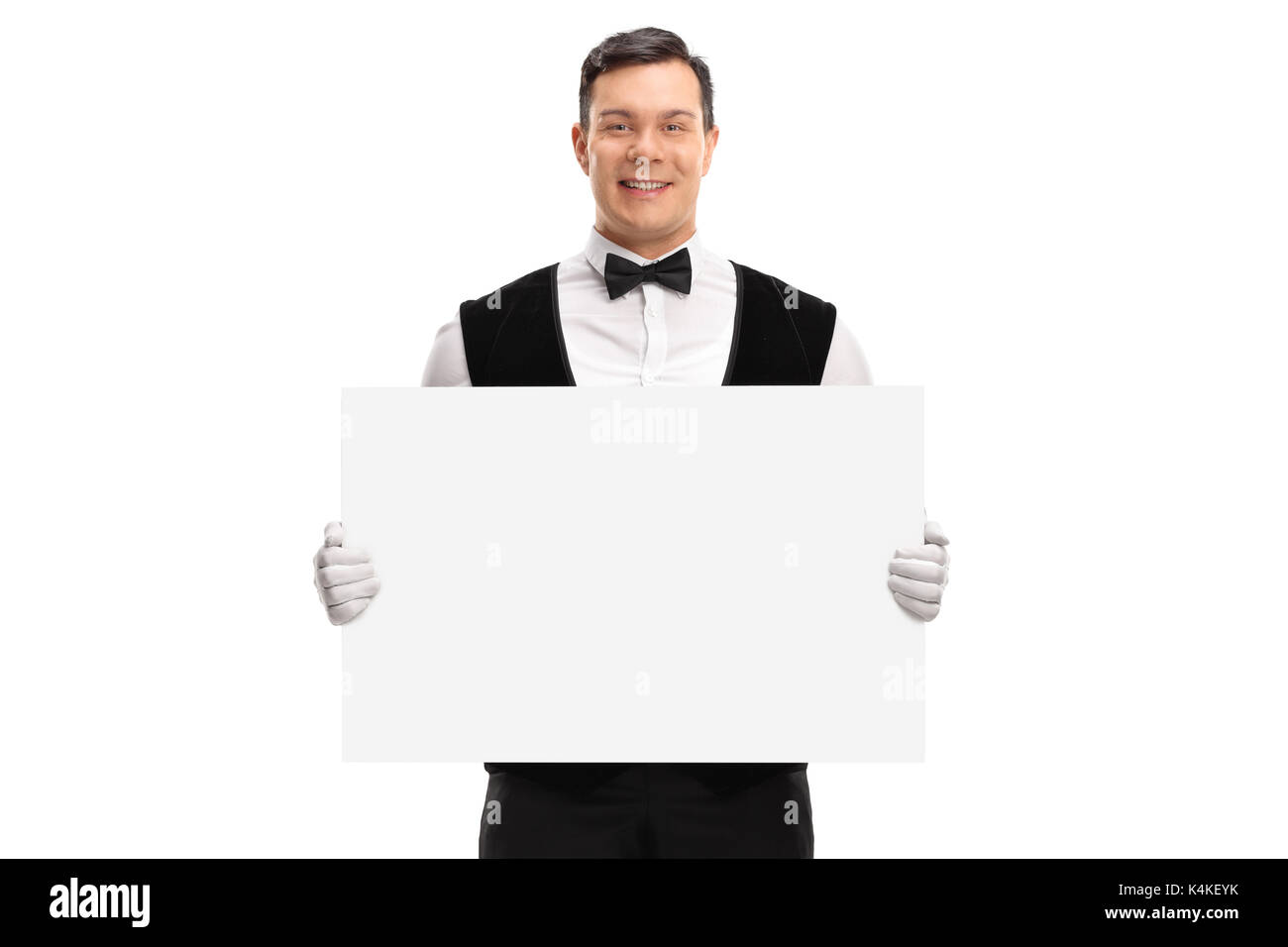 Waiter holding a blank cardboard sign and smiling isolated on white ...