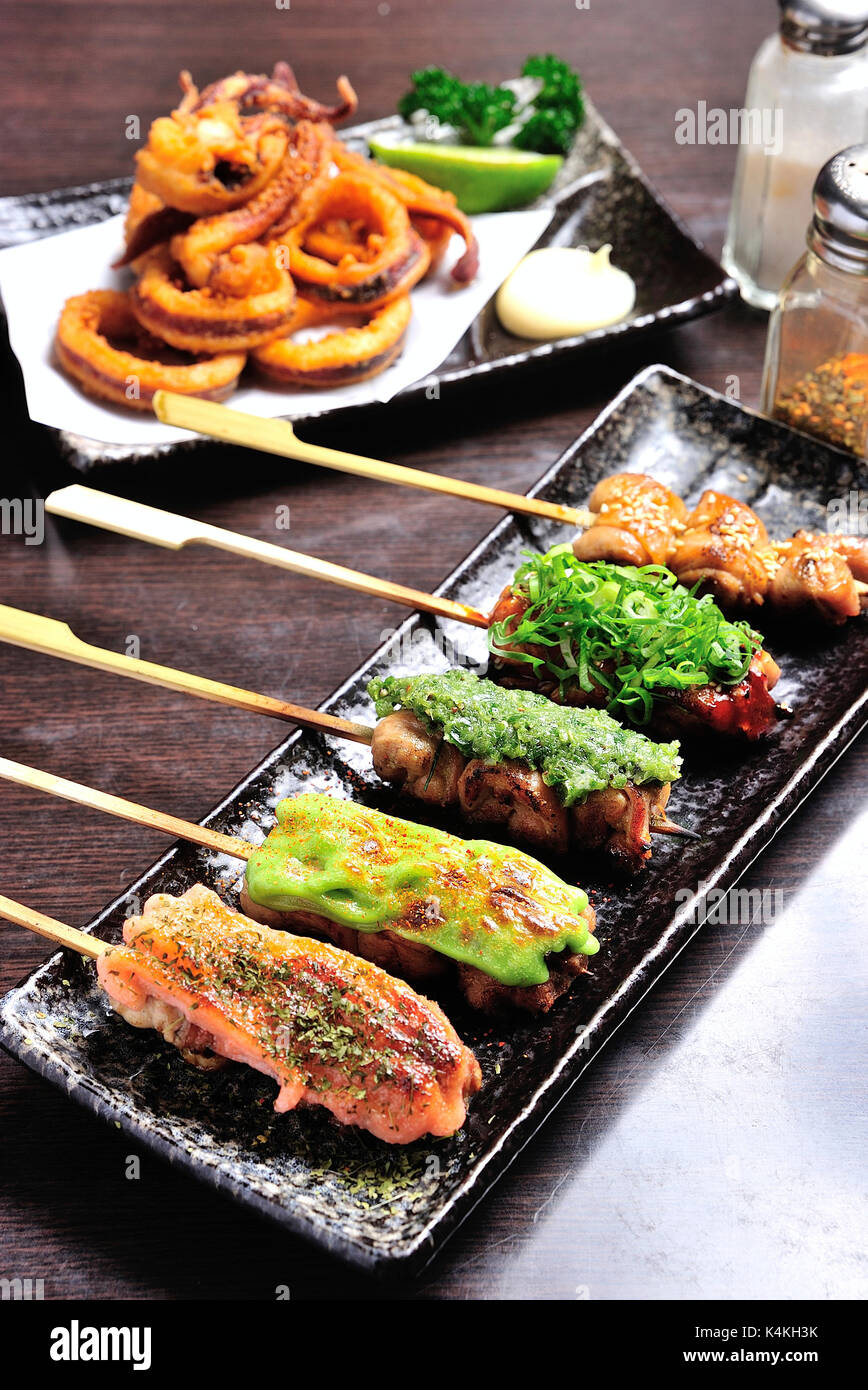 squid and chicken string Stock Photo - Alamy