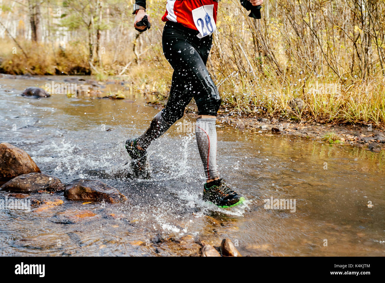 male runner running on mountain river water spray Stock Photo - Alamy
