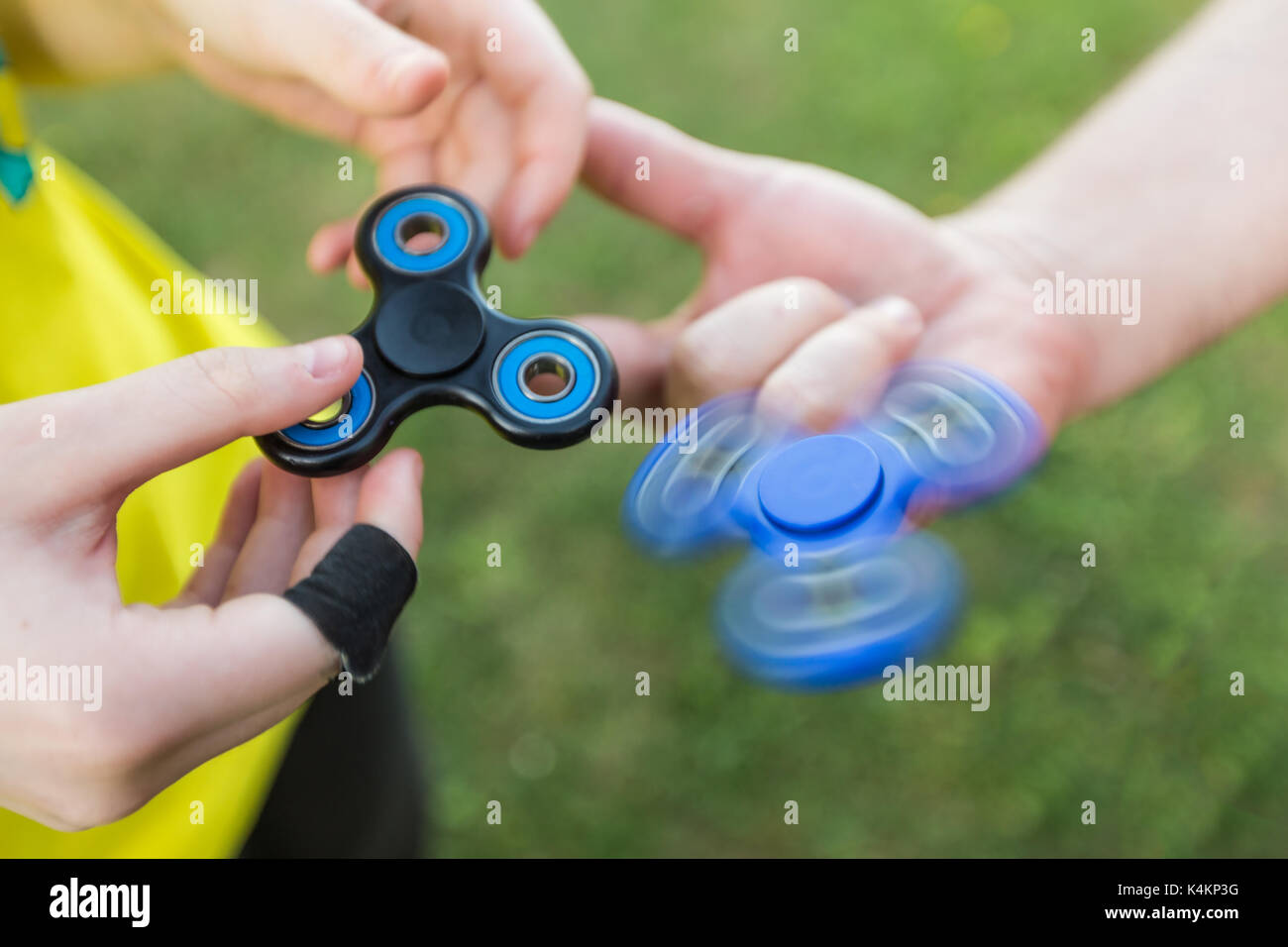 Father and daughter holding and spinning fidget spinners Stock Photo ...